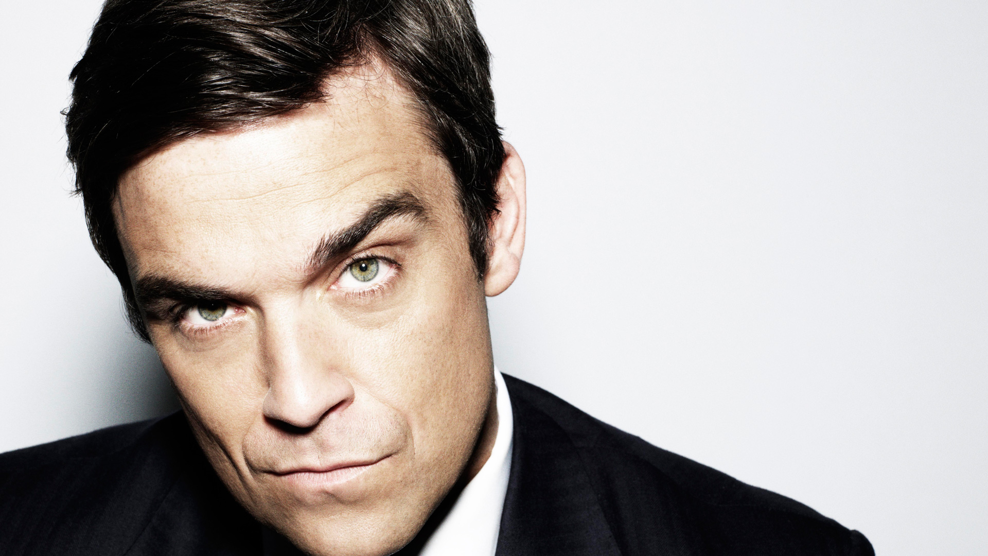 ROBBIE WILLIAMS : Sa biographie, ses albums, ses concerts